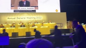 Shell CEO shielded by security as climate protesters try to storm shareholder meeting