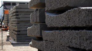 Construction workers neatly stacking insulated concrete forms - icf - at industrial building site, showcasing modern building materials preparation for architectural development projects