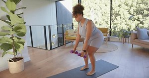 clip-3694943971-exercising-dumbbells-plus-size-woman-working-out