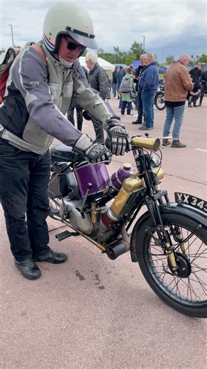 A 1925 Scott Super Squirrel (600cc three-speed) is fired up at the end of the VMCC Banbury Run. The two-stroke Super Squirrel was introduced in 1925 as a development from the 1924 TT machines (the 596 c.c. model put up the record lap in the course in the sidecar race). These motorcycles went against the grain - two-stroke, water-cooled, and of stood with an unusual stance. Watch to hear the iconic “yowl” of the engine when it is started up. Video and content is original and copyright to The Gird