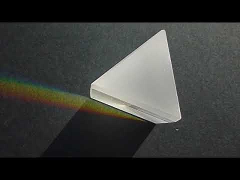 Rainbow and Prism. Light refraction with a prism. Refraction of the light through a glass prism