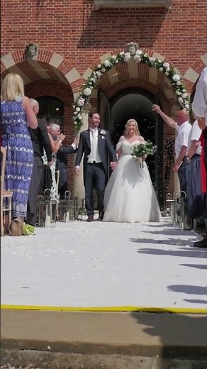 Bride and groom walking down the aisle