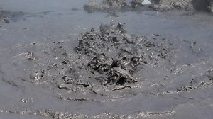 Watch mud volcano erupt beneath a crown of flames in Taiwan