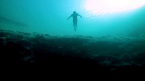 Guillaume Nery base jumping at Dean's Blue Hole (Trentemøller Edit)