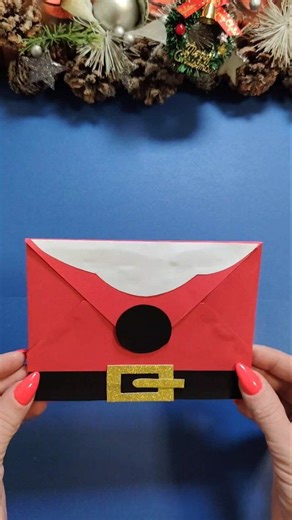 Here’s a festive way to give cash or small gifts this Christmas. I made this adorable Santa-themed envelope entirely from paper, and it’s such a fun alternative to store-bought envelopes. Personal, handmade, and full of holiday charm. Try it for your Christmas gifts this year! #ChristmasCrafts #HandmadeWithLove #HolidayGifting #CreativeIdeas #DIYCrafts #SantaEnvelope #FestiveSeason #CraftingCommunity | Made By Hand