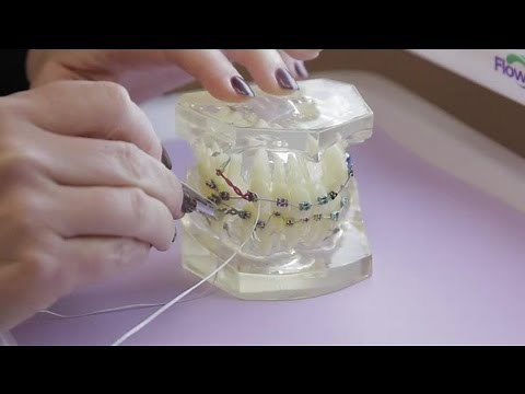 How to Remove Floss Trapped Between Teeth : Caring for Your Teeth