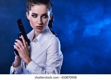 Foto Stok Beautiful Sexy Girl Holding Gun Smoke Edit Sekarang 411442654
