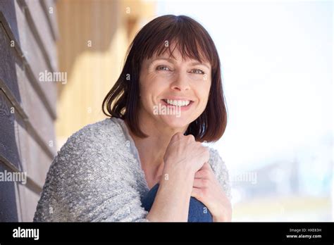 Close Up Portrait Of An Attractive Older Woman Smiling Stock Photo Alamy