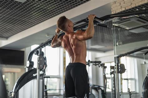 Premium Photo Handsome Strong Muscular Man With Naked Torso Doing