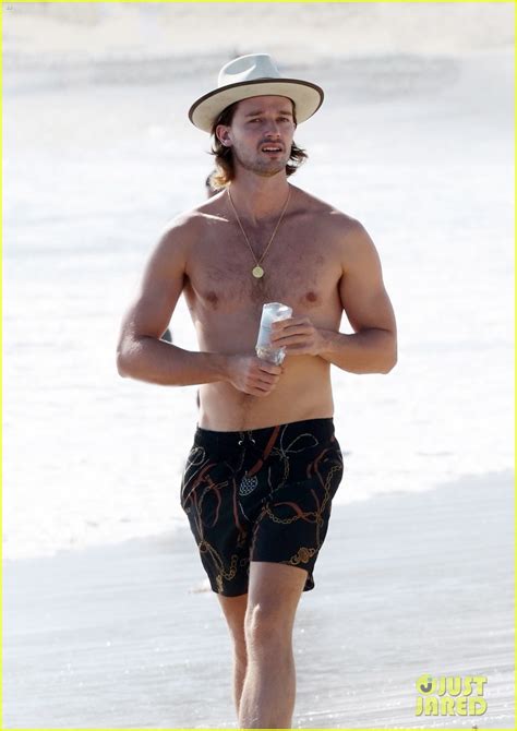 Patrick Schwarzenegger Looks Fit Going Shirtless At The Beach Photo