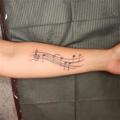 56 Melodiously Meaningful Music Note Tattoo Ideas For 2024