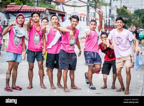 Young Filipino Men Joke Around Before Heading Out On The Famous Annual Black Nazarene Religious