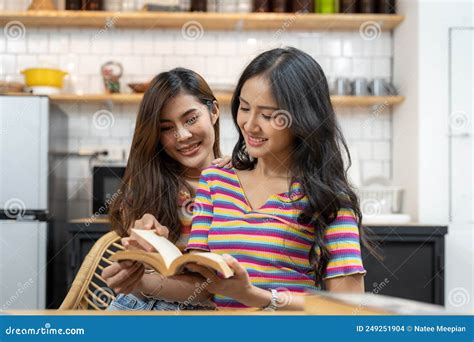 Happy Lesbian Lgbtq Couple In Love Cuddling Laughing Having Fun At Home Two Diverse Pretty