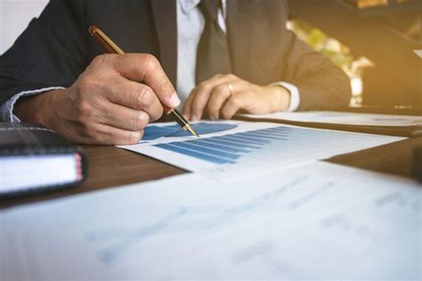 Premium Photo Midsection Of Businessman Analyzing Data