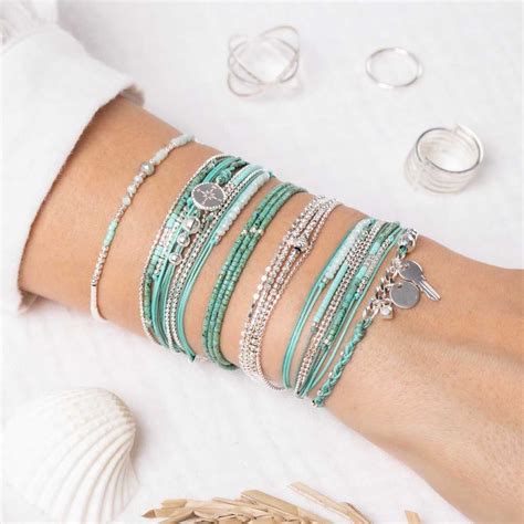 BRACELET ELASTIQUE MIYUKI TURQUOISE TACHETÉ TRIPLE TOURS Bracelet