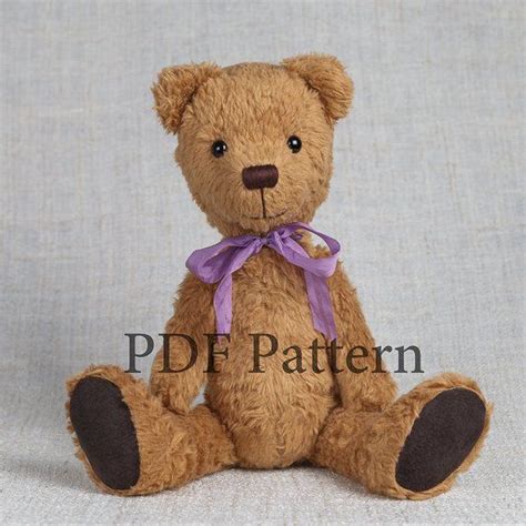 A Brown Teddy Bear With A Purple Ribbon Around Its Neck Sitting On A