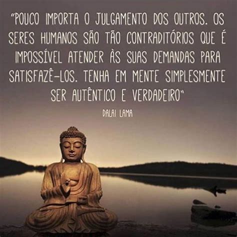A Buddha Statue Sitting On Top Of A Body Of Water