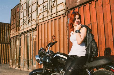 Redhead Woman Leaning On A Motorcycle By Stocksy Contributor B Krokodil Stocksy