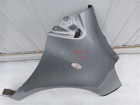 BŁOTNIK PRAWY PRZÓD PRAWY PRZEDNI TOYOTA YARIS II BŁOTNIK YARIS II za