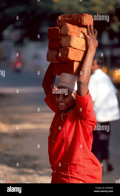 Woman Carrying Bricks On Head Hi Res Stock Photography And Images Alamy