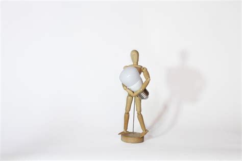 Premium Photo Close Up Of Figurine Against White Background