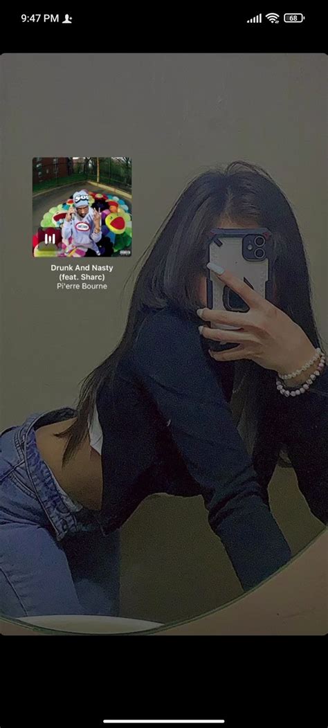 A Woman Taking A Selfie With Her Cell Phone