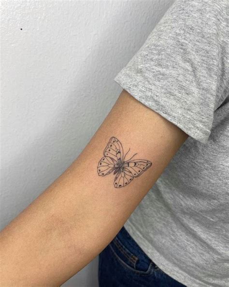 Fine Line Butterfly Tattoo Located On The Bicep