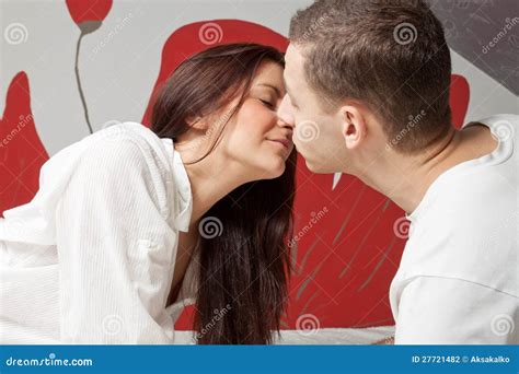 Man And Woman Kissing In The Bed Stock Photography Image