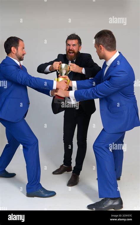 Coworkers Tear Winners Cup As Symbol Of Success Businessmen With Angry