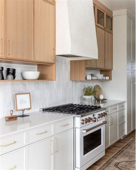A Kitchen With An Oven Stove And Cabinets