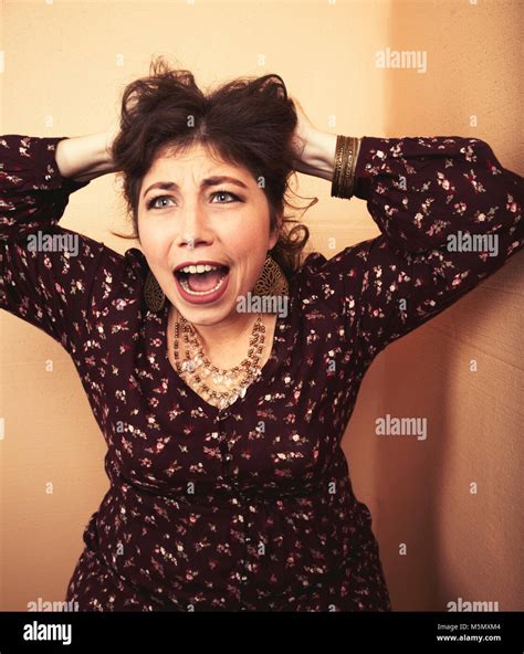 Woman Pulling Her Hair And Screaming Stock Photo Alamy