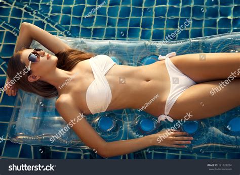 Beautiful Woman Sunbathing Swimming Pool Stock Photo 121828204