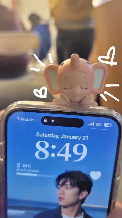 Someone Is Holding Up Their Cell Phone With An Image Of A Monkey On It