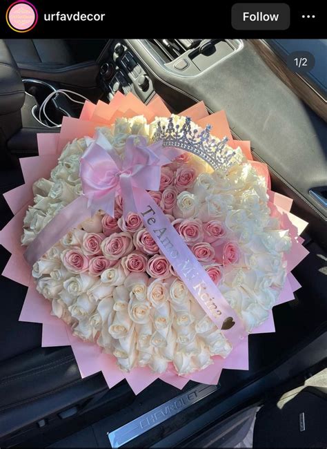 A Bouquet Of Roses In The Shape Of A Heart With A Tiara On Top