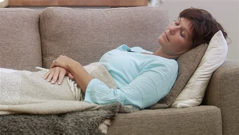 Locked On Shot Of A Woman Lying On The Bed And Talking On A Mobile Phone Stock Footage Video