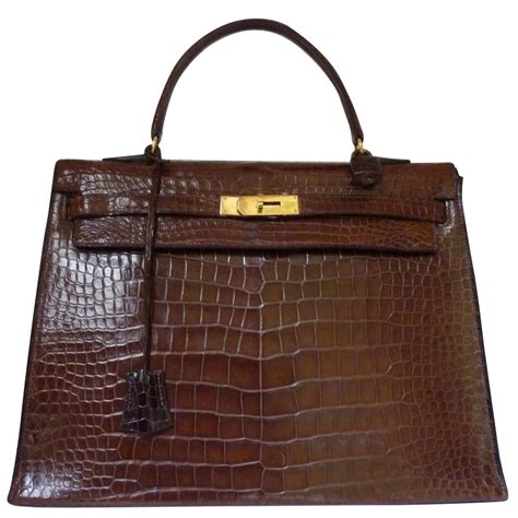 Sacs à main Hermès Superbe Kelly vintage en crocodile marron Cuirs