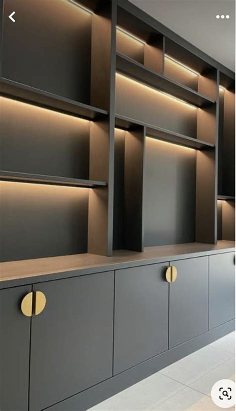 An Empty Room With Shelves And Cupboards