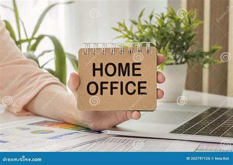 Home Office Text On Sticky Notes In Hand With Office Desk Stock Photo