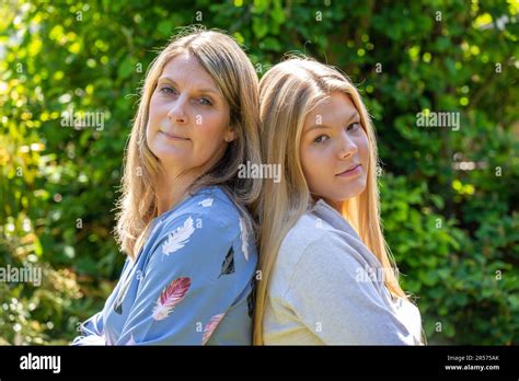 Mother And Teen Daughter Back To Back Fighting Stock Photo Alamy