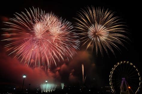 Premium Ai Image Fireworks Are Lit Up In The Night Sky Above A Ferris
