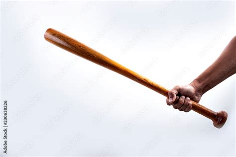 Hand Holding Wooden Baseball Bat On White Background Stock Photo