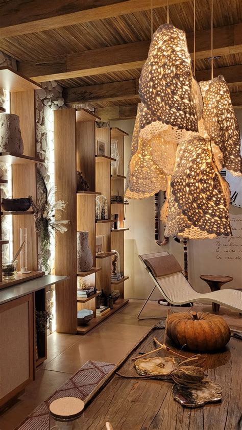 A Wooden Table Topped With Lots Of Lights Hanging From It S Ceiling And