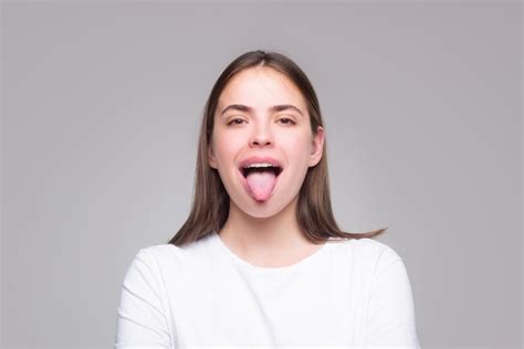 Premium Photo Beautiful Modern Model Shows Tongue Model With Sticking
