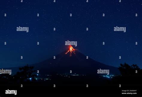 Lava Cascades Down The Slopes Of Mayon Volcano During Its Eruption For
