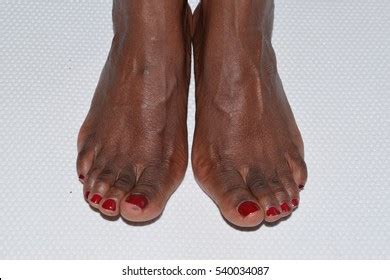 African American Red Painted Toenails Curled Stock Photo 540034087
