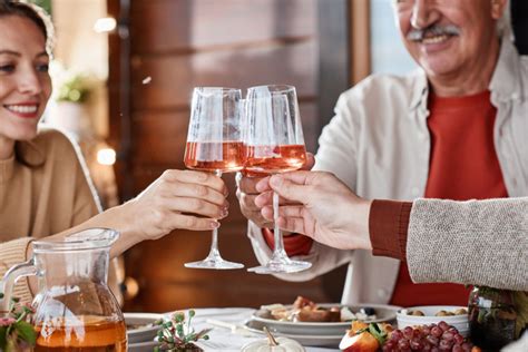 Adults Clink Glasses With Red Wine Stock Image Everypixel