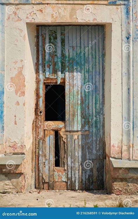 Old Door Of A Dilapidated And Poorly Maintained House In Damaged White
