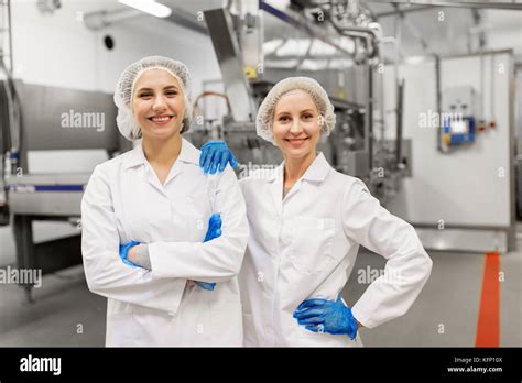 Happy Women Technologists At Ice Cream Factory Stock Photo Alamy