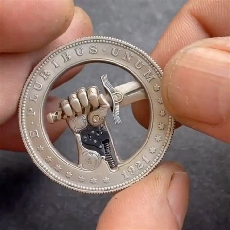 A Person Is Holding A Small Metal Object