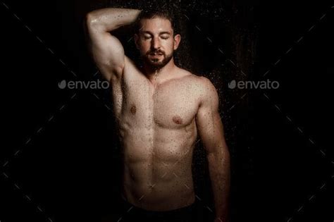 Handsome Shirtless Male In A Studio Posing For A Photo Stock Photo By